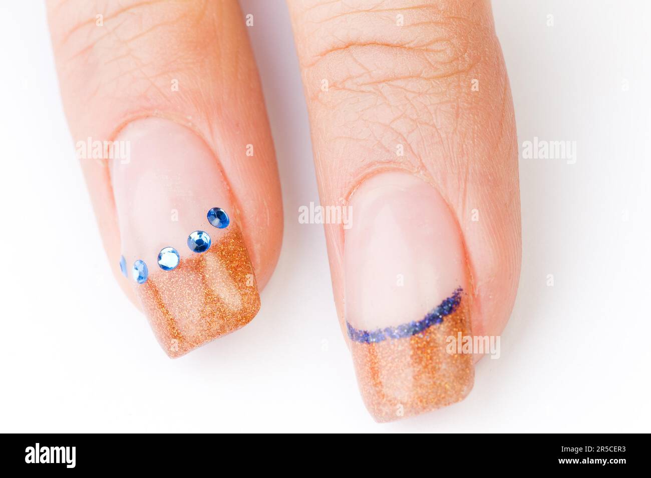 Beautiful female manicured colourful fingernails against a white ...