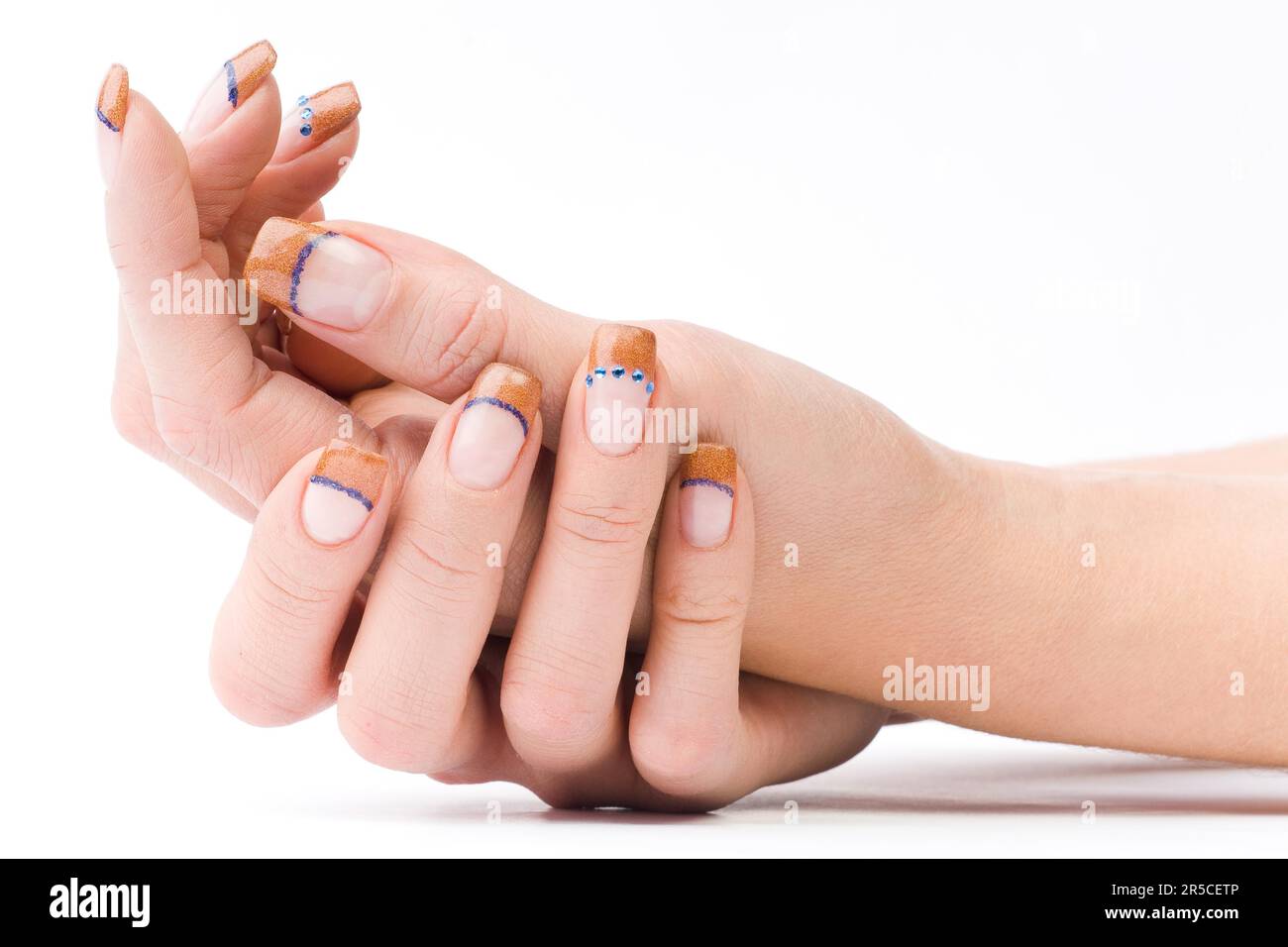 Beautiful female manicured colourful fingernails against a white ...