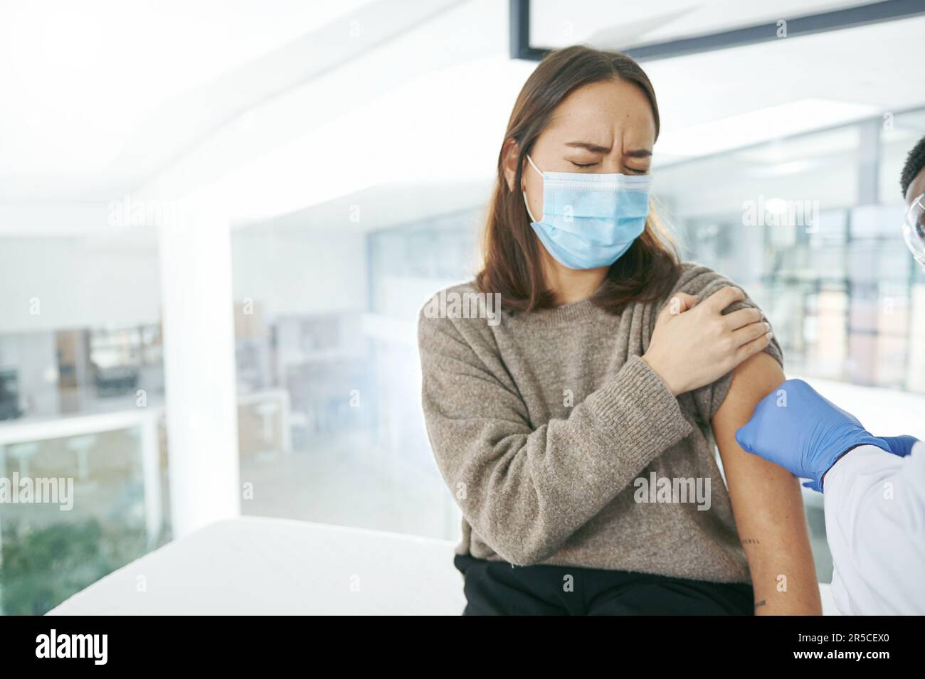 Please make it quick. an unrecognizable doctor giving a patient an ...