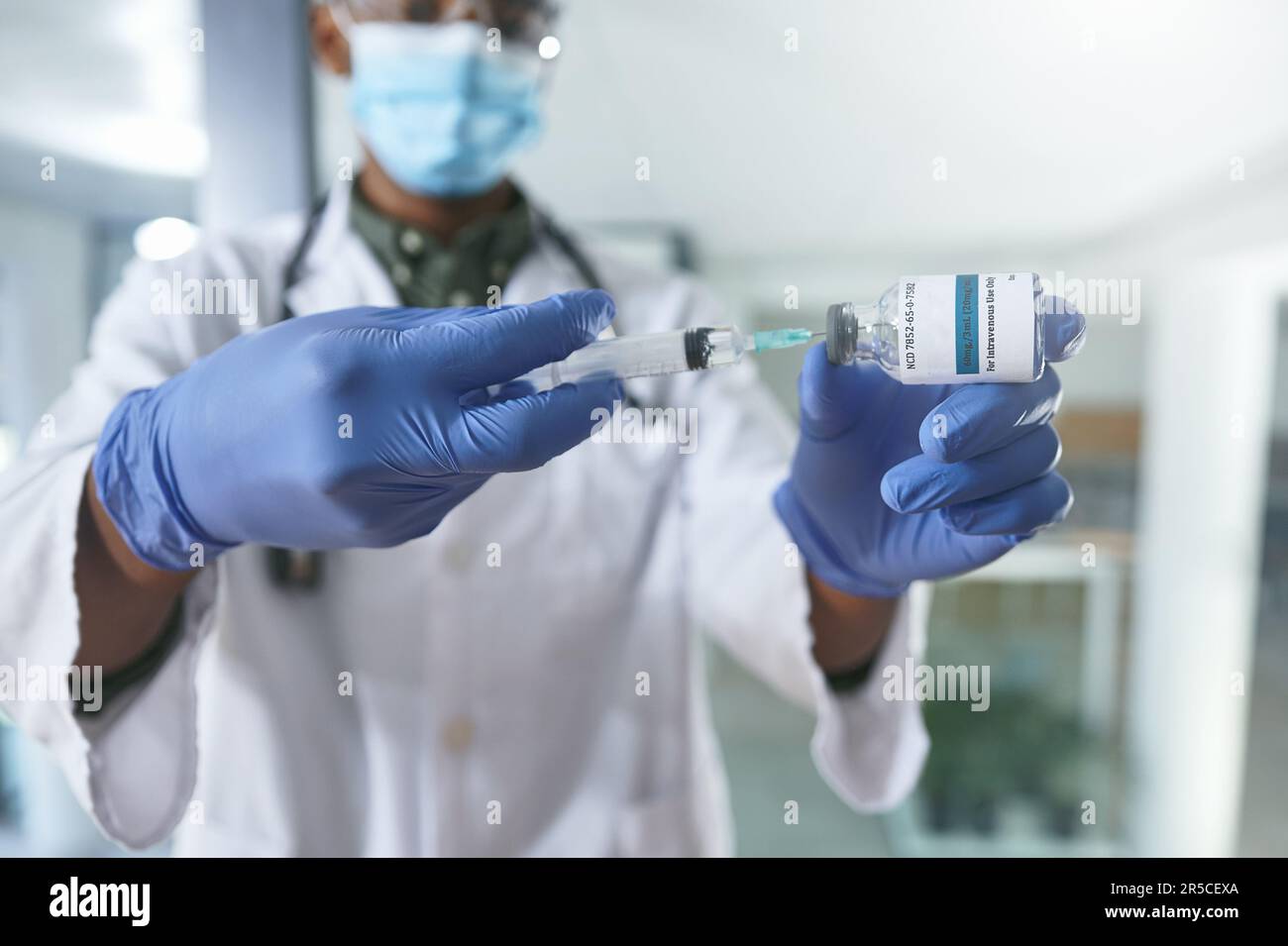 Need to get all the liquid in there. a young doctor extracting liquid ...