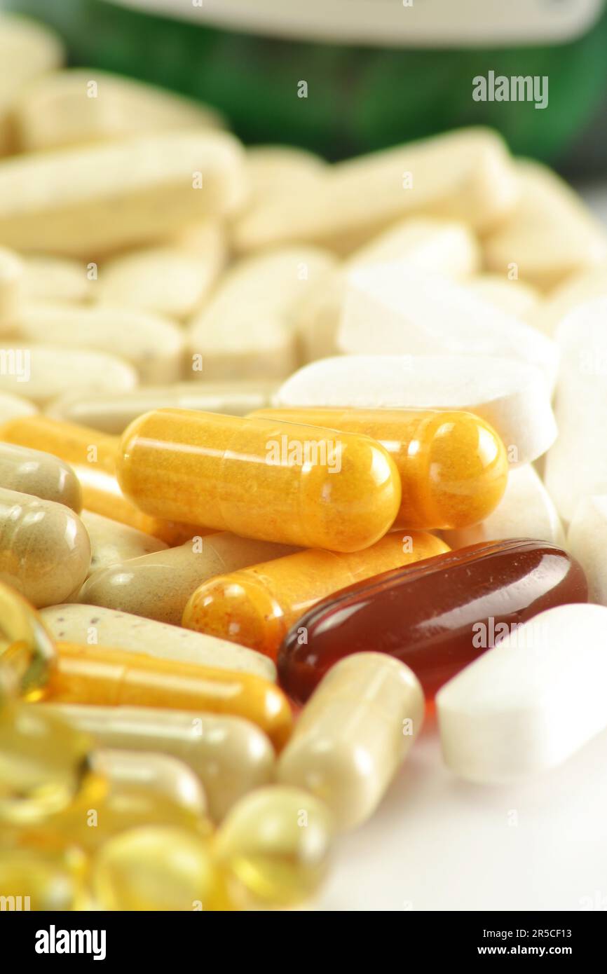 Composition with dietary supplement capsules and containers. Variety of ...