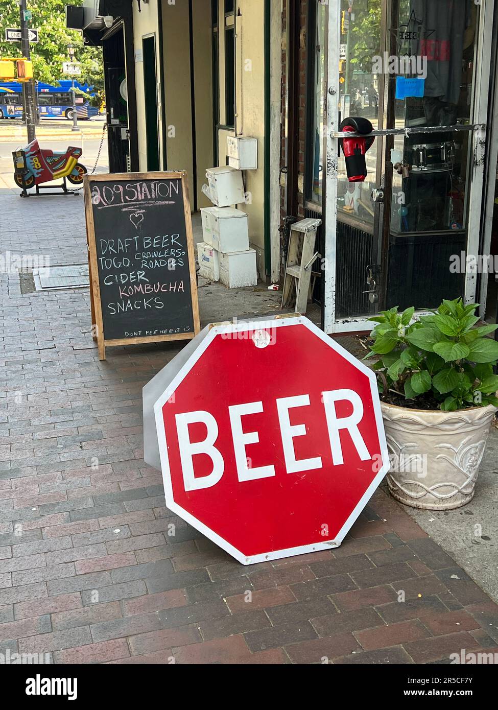 Beer ad in the shape of a stop sign on the street in Windsor Terrace ...
