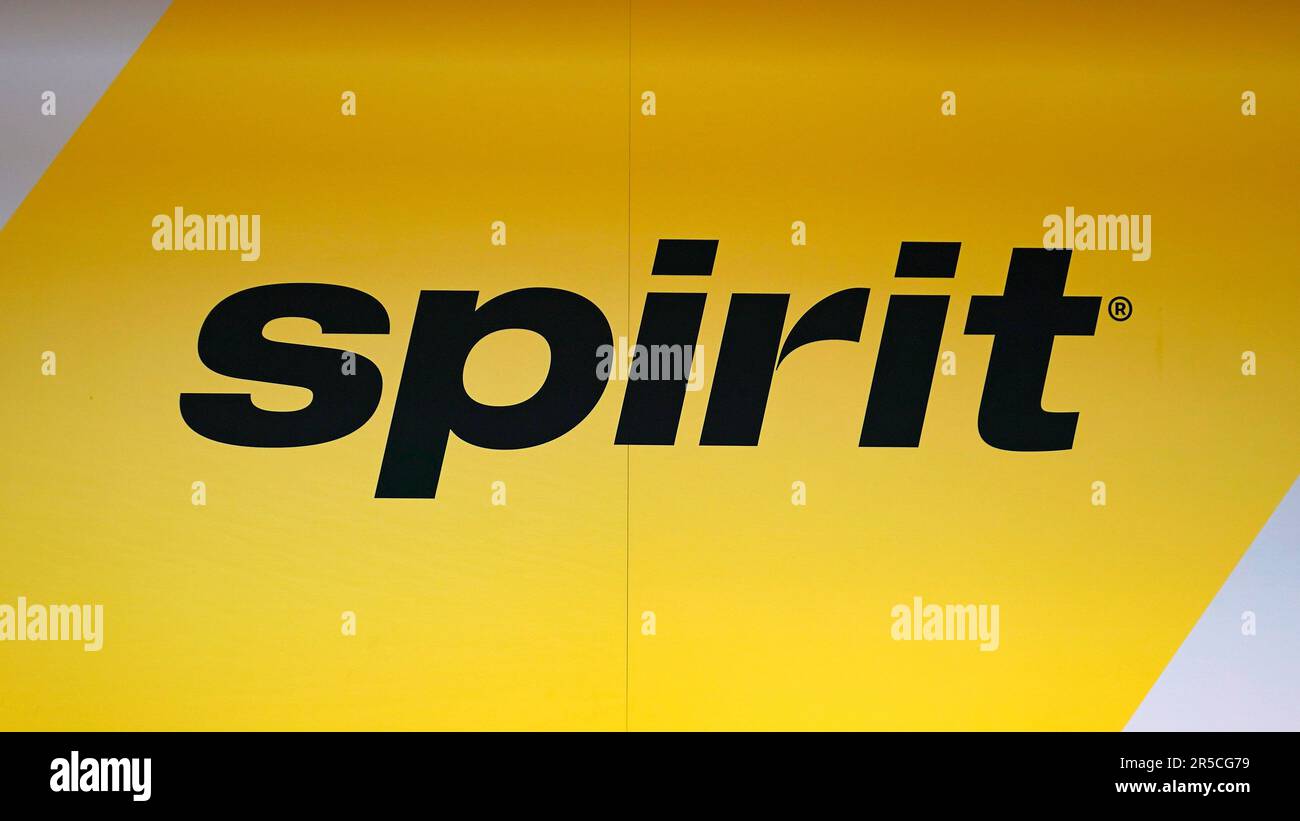 The Spirit Airlines logo is seen at the ticket counter at Manchester ...