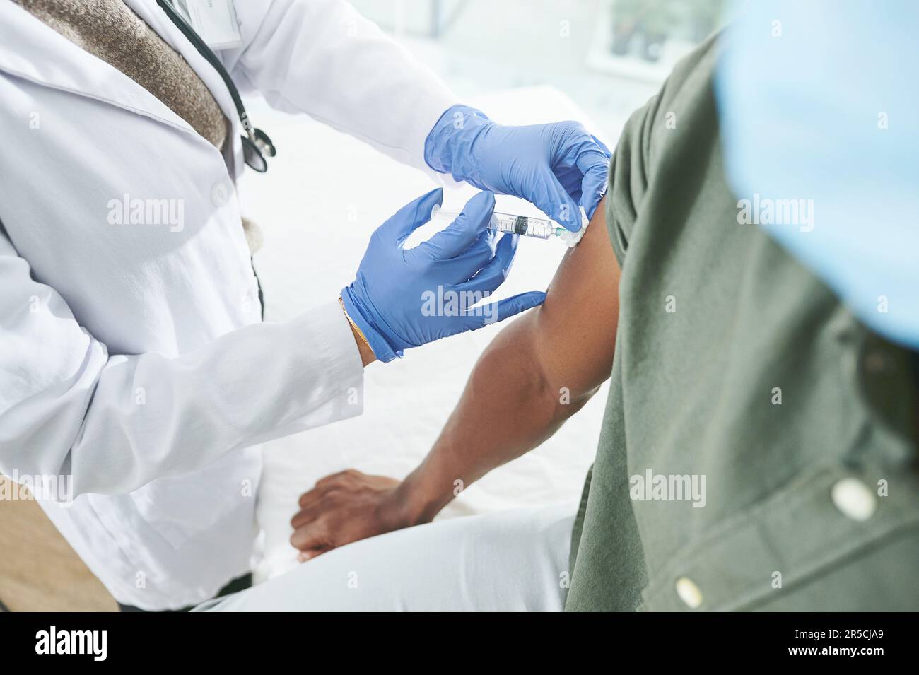 Were almost done here. an unrecognizable doctor giving a patient an ...