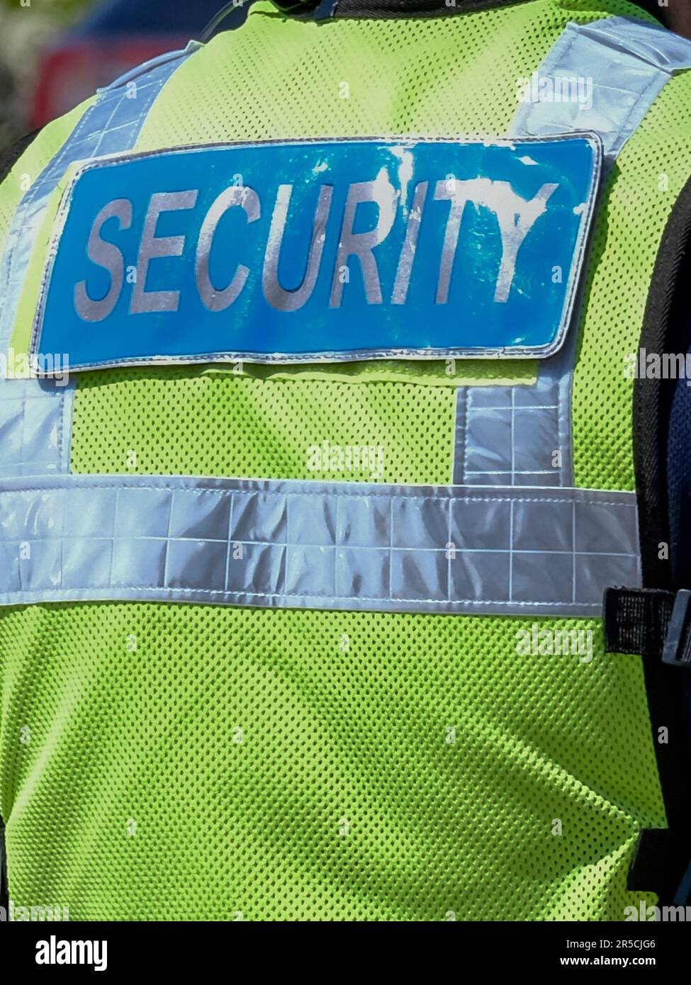 Photo of a security guard showing the word 'security' on his back Stock ...