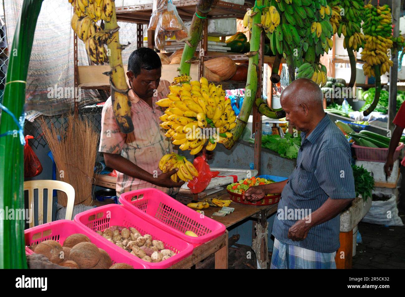 Vendor and customer at fruit stall, fruit market. Male, Maldives Stock ...