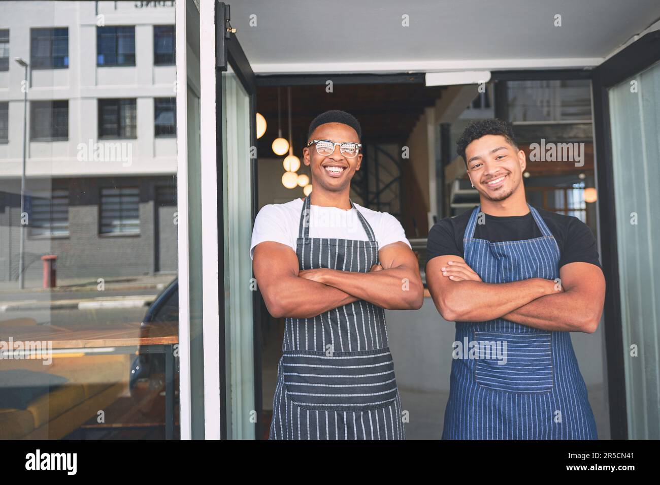Our doors are open to get your day started. two confident young men ...