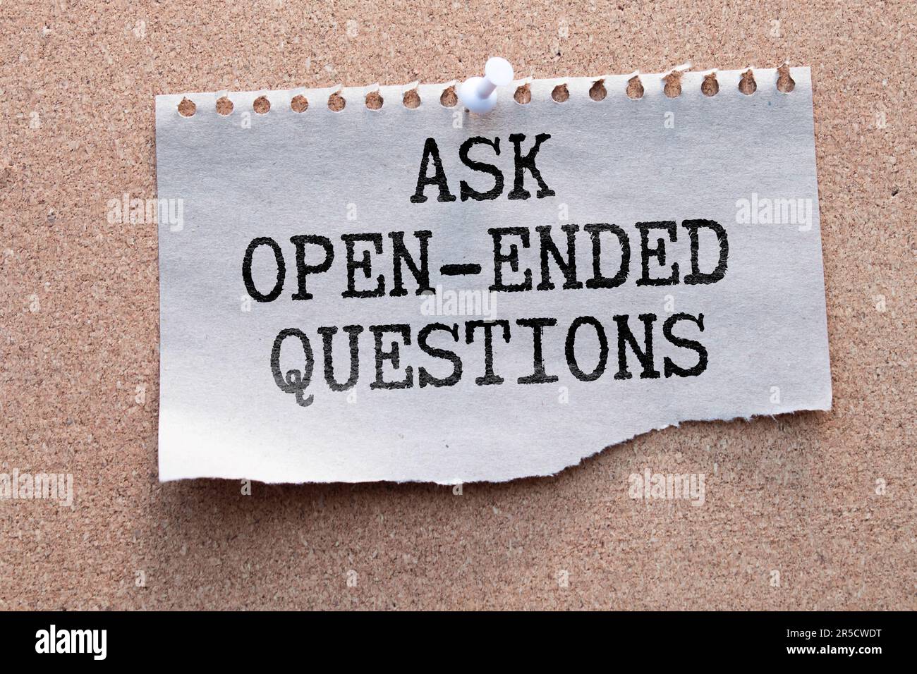 Ask Open-Ended Questions written on a notebook page, pencil on the left ...