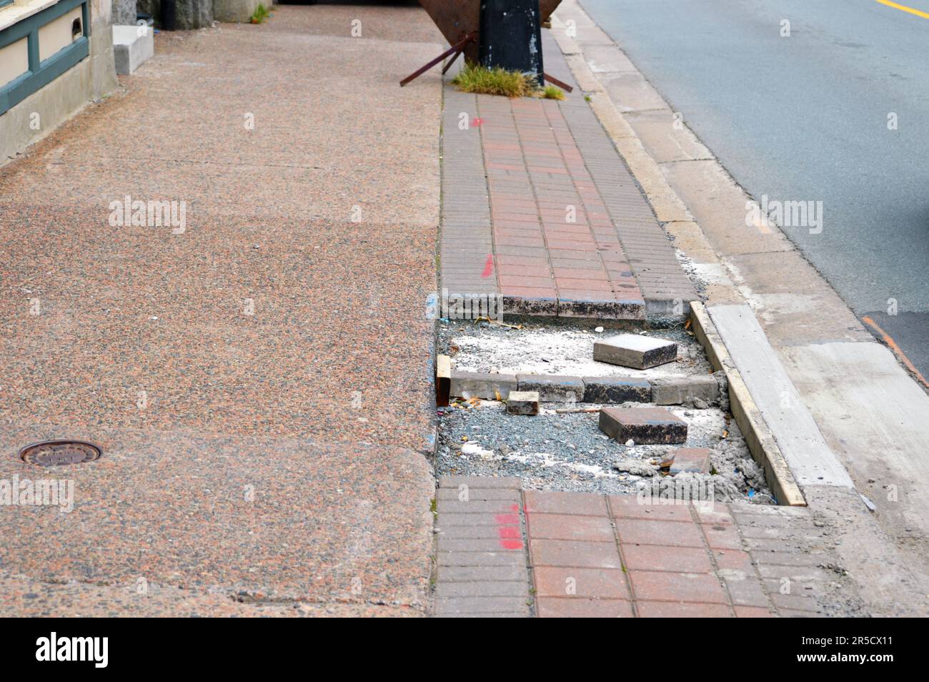 Missing pavers along a sidewalk in downtown Halifax, Nova Scotia ...