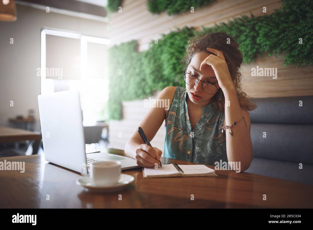 High pressure takes its toll on productivity. a young woman looking ...