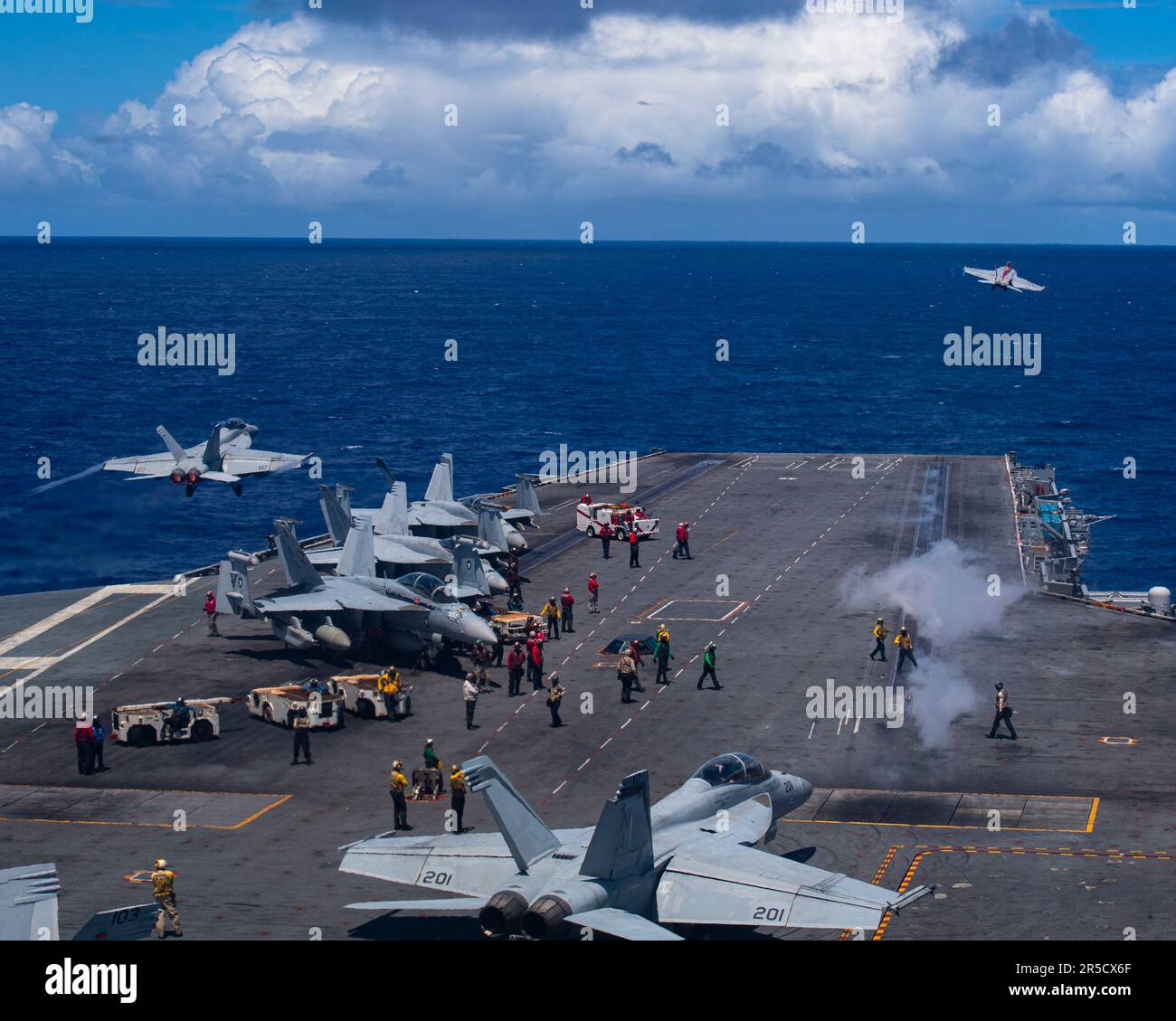 230602-N-MH015-1045 PACIFIC OCEAN (June 2, 2023) A U.S. Navy Sailor directs an F/A-18F Super ...