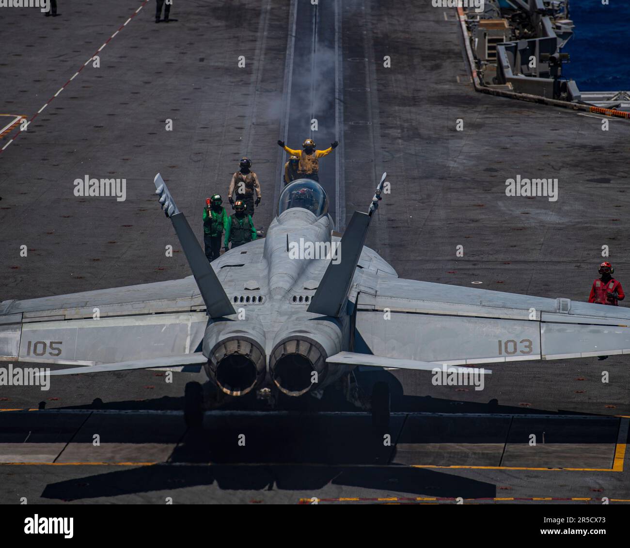 230602-N-MH015-1045 PACIFIC OCEAN (June 2, 2023) A U.S. Navy Sailor directs An F/A-18F Super ...