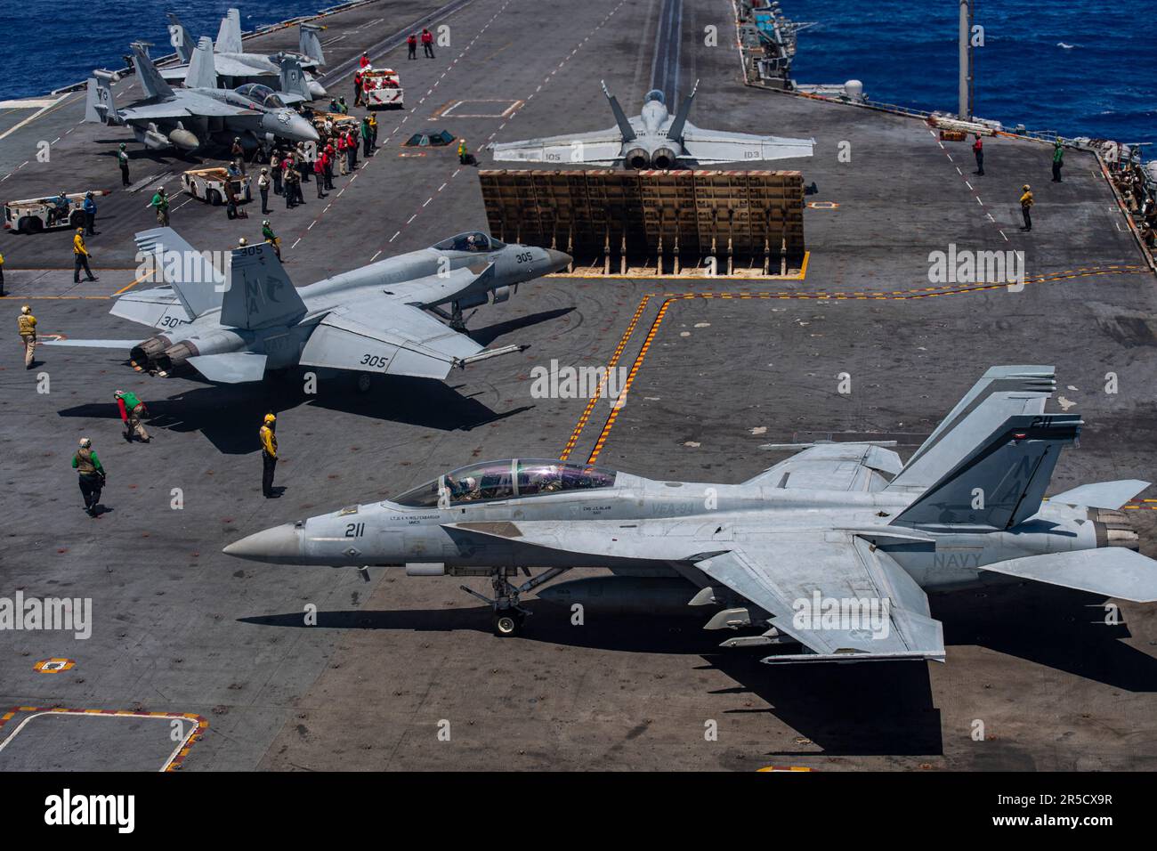 230602-N-MH015-1063 PACIFIC OCEAN (June 2, 2023) Aircraft taxi across the flight deck of the ...