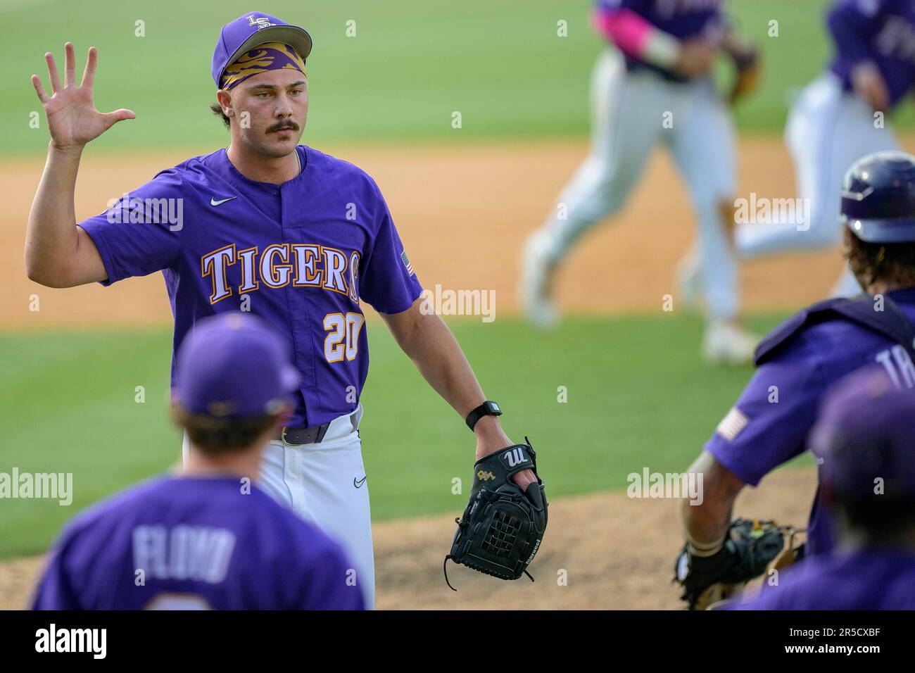 LSU pitcher Paul Skenes (20) goes to high five LSU catcher Hayden ...