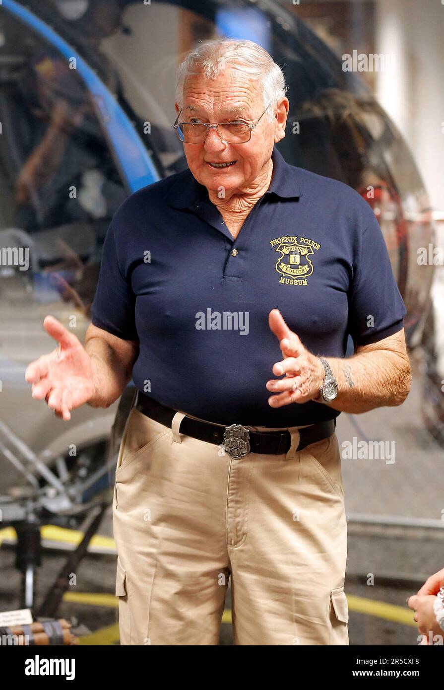 Retired Phoenix Police Capt. Carroll Cooley talks to guests Wednesday, March 13, 2013 at the ...