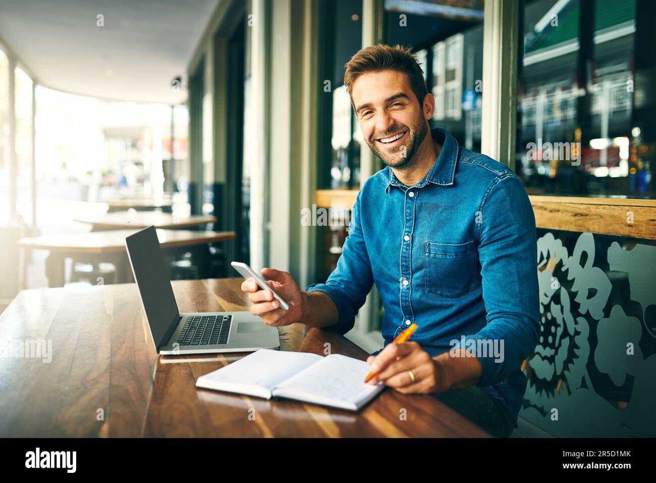 Multitasking is part of an entrepreneurs life. Cropped portrait of a ...