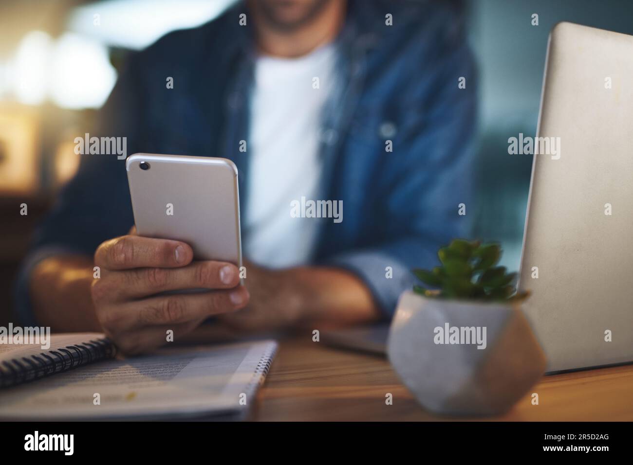 Working from all angles. an unrecognisable businessman using his ...