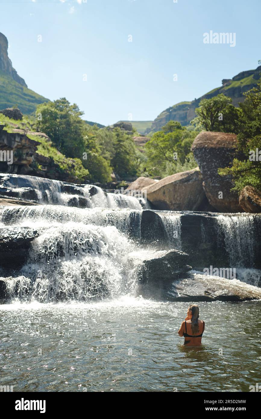 Choosing tranquility above all else. an unrecognizable woman swimming ...