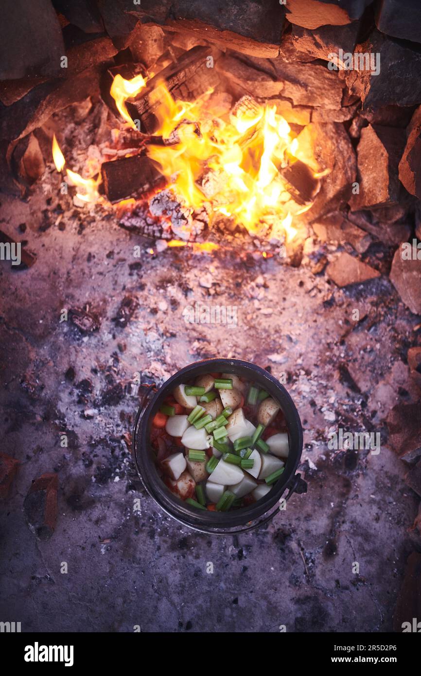 Dinner is served courtesy of a campfire. a traditional South African ...