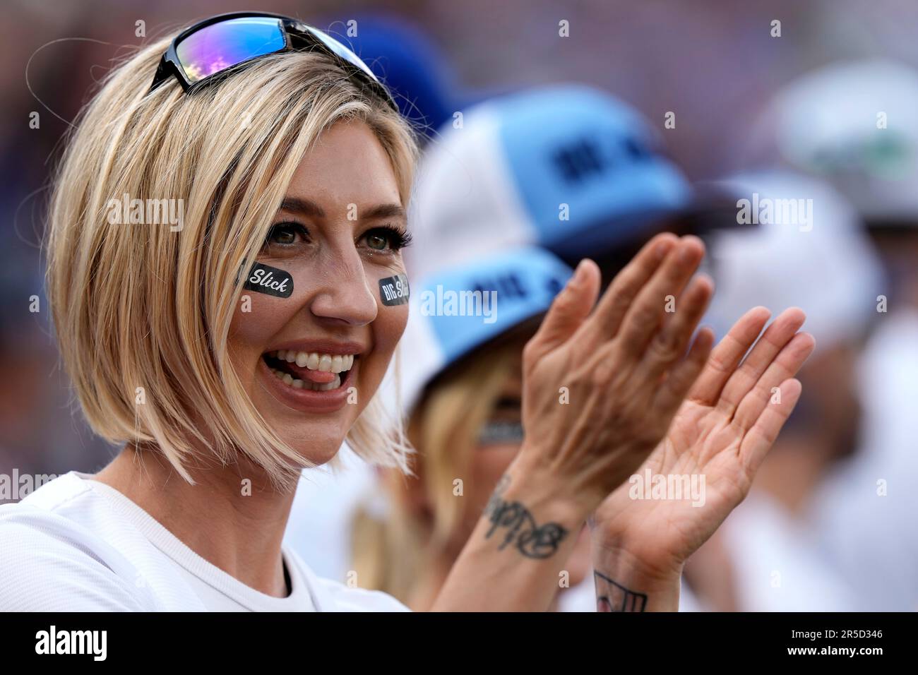 Actor Heidi Gardner cheers during a celebrity softball game at Kauffman ...