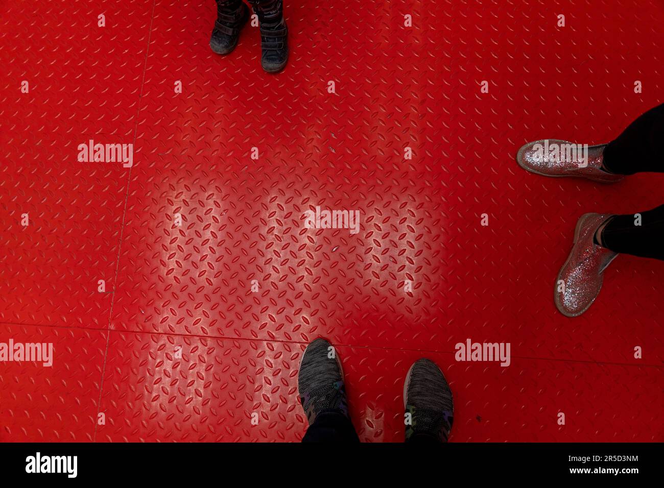 metal red painted surface floor view on feet Stock Photo - Alamy