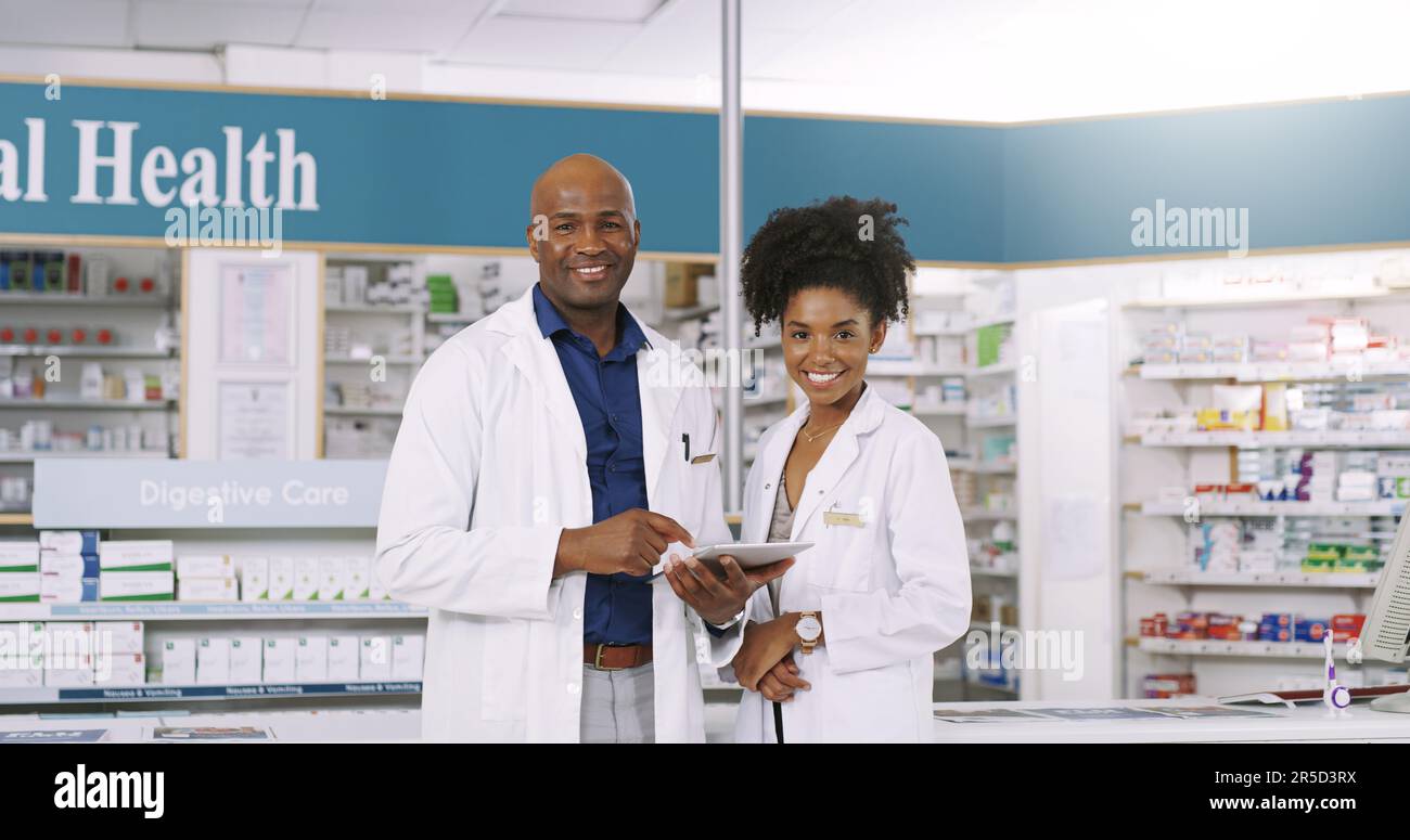 Your wellbeing is our top priority. Cropped portrait of two pharmacists ...