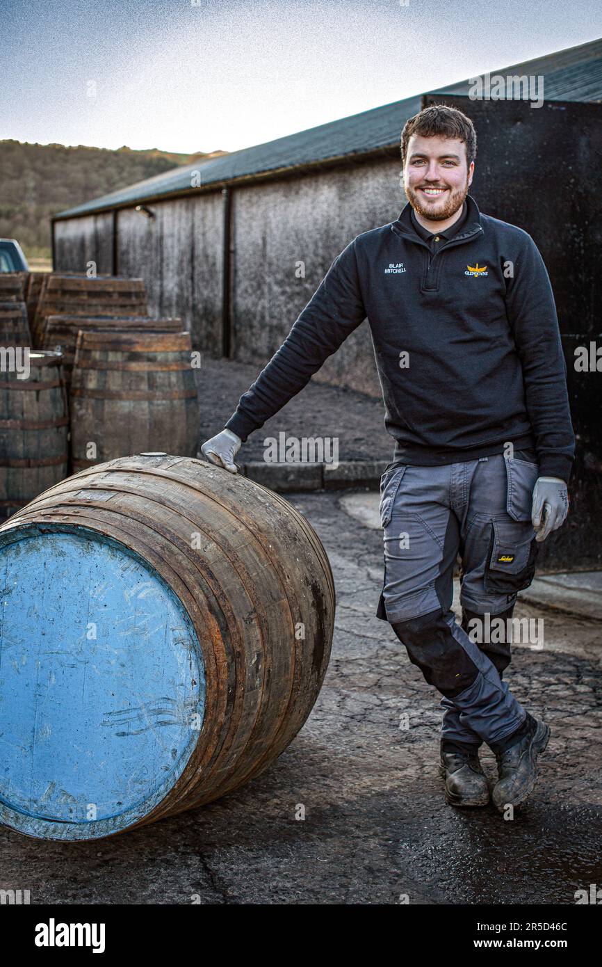 Warehouse man standing next to whisky cask Glengoyne Distillery ...