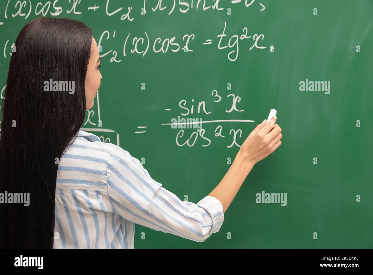 Teacher explaining formula chalkboard hi-res stock photography and ...
