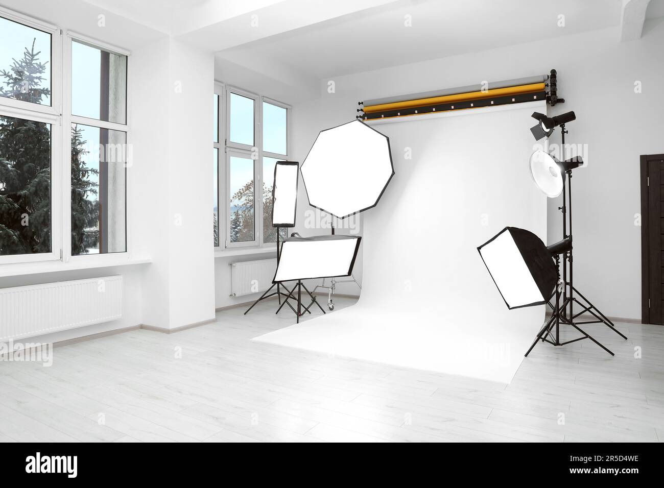 Interior of modern photo studio with professional lighting equipment ...