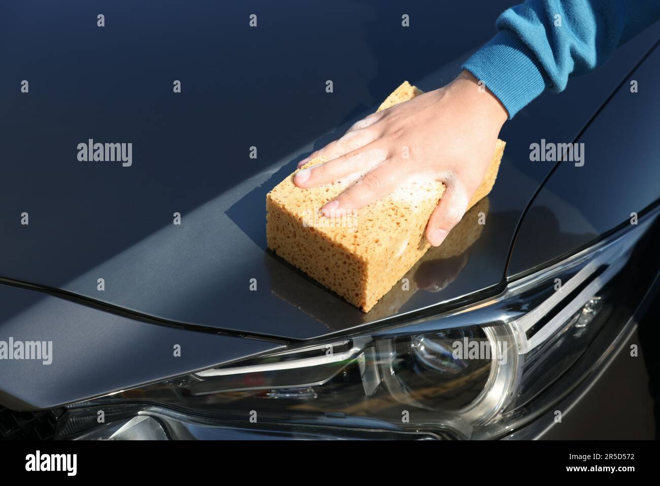 Man washing car hood hi-res stock photography and images - Alamy