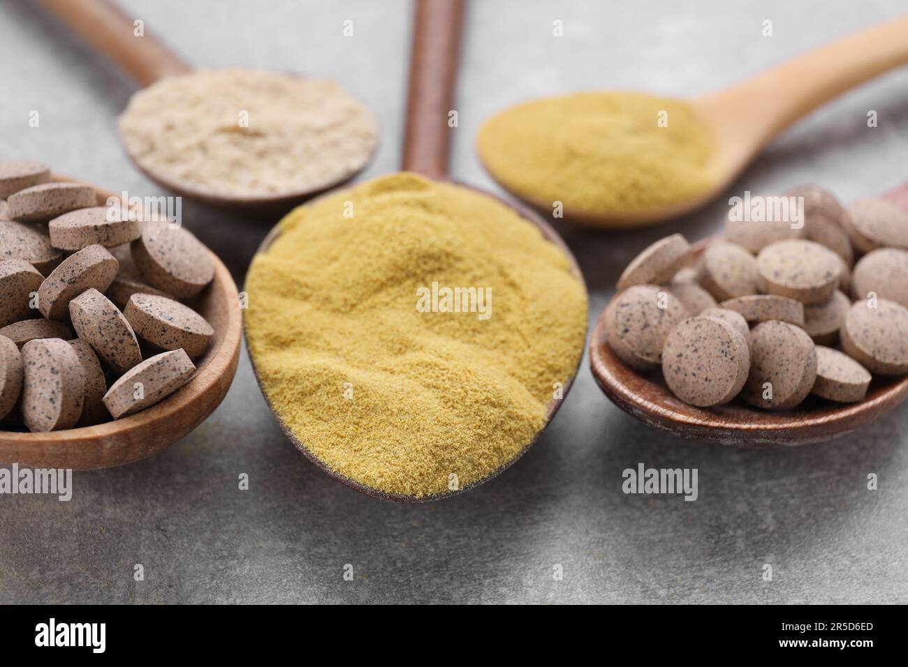 Different types of brewer's yeast on grey table, closeup Stock Photo ...