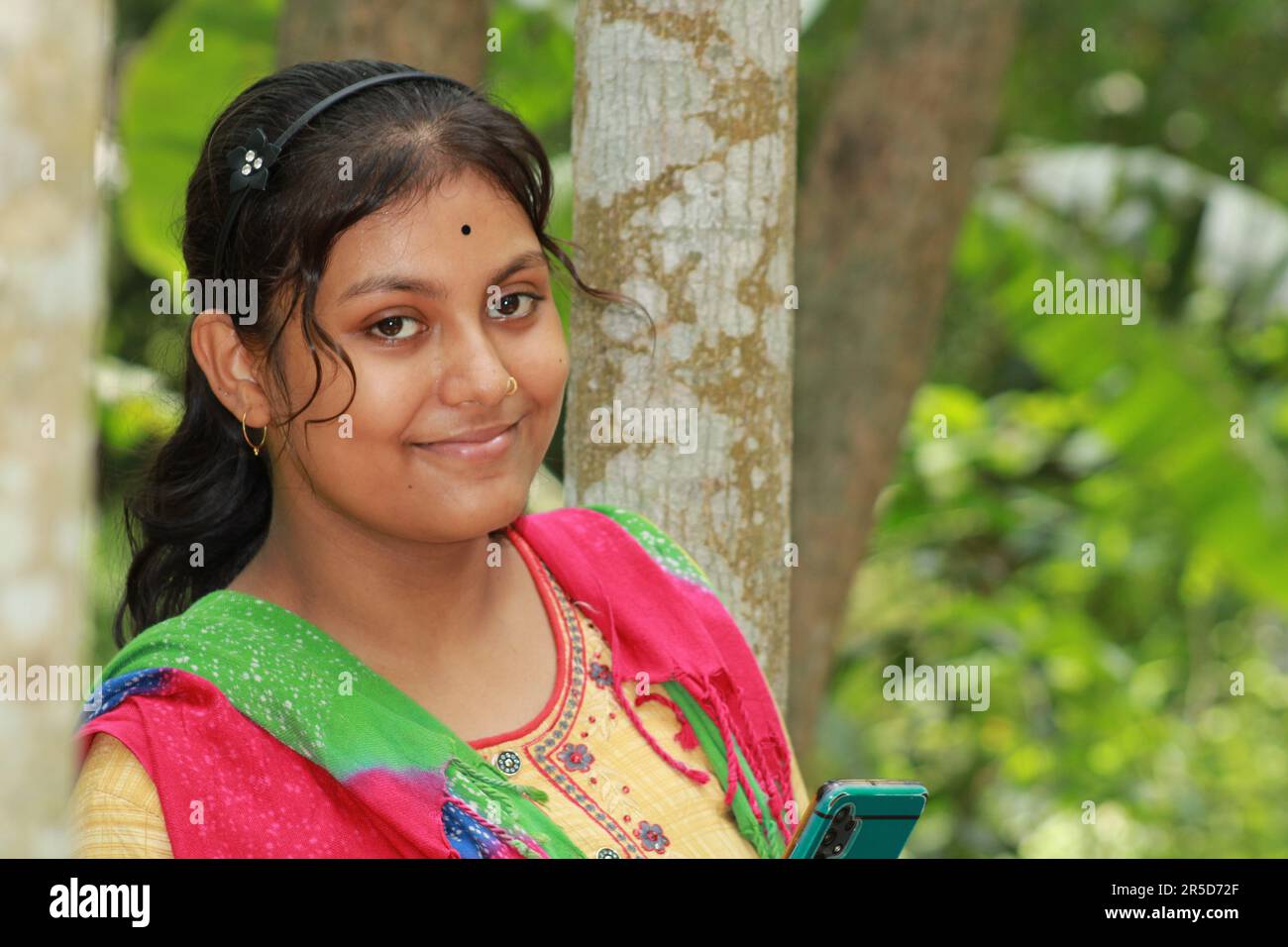 Close up of a beautiful teenage Indian Odia girl wearing colorful Dress ...