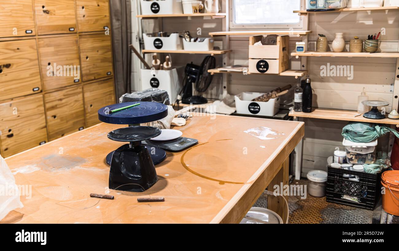 Pottery work desk in a pottery studio Stock Photo - Alamy