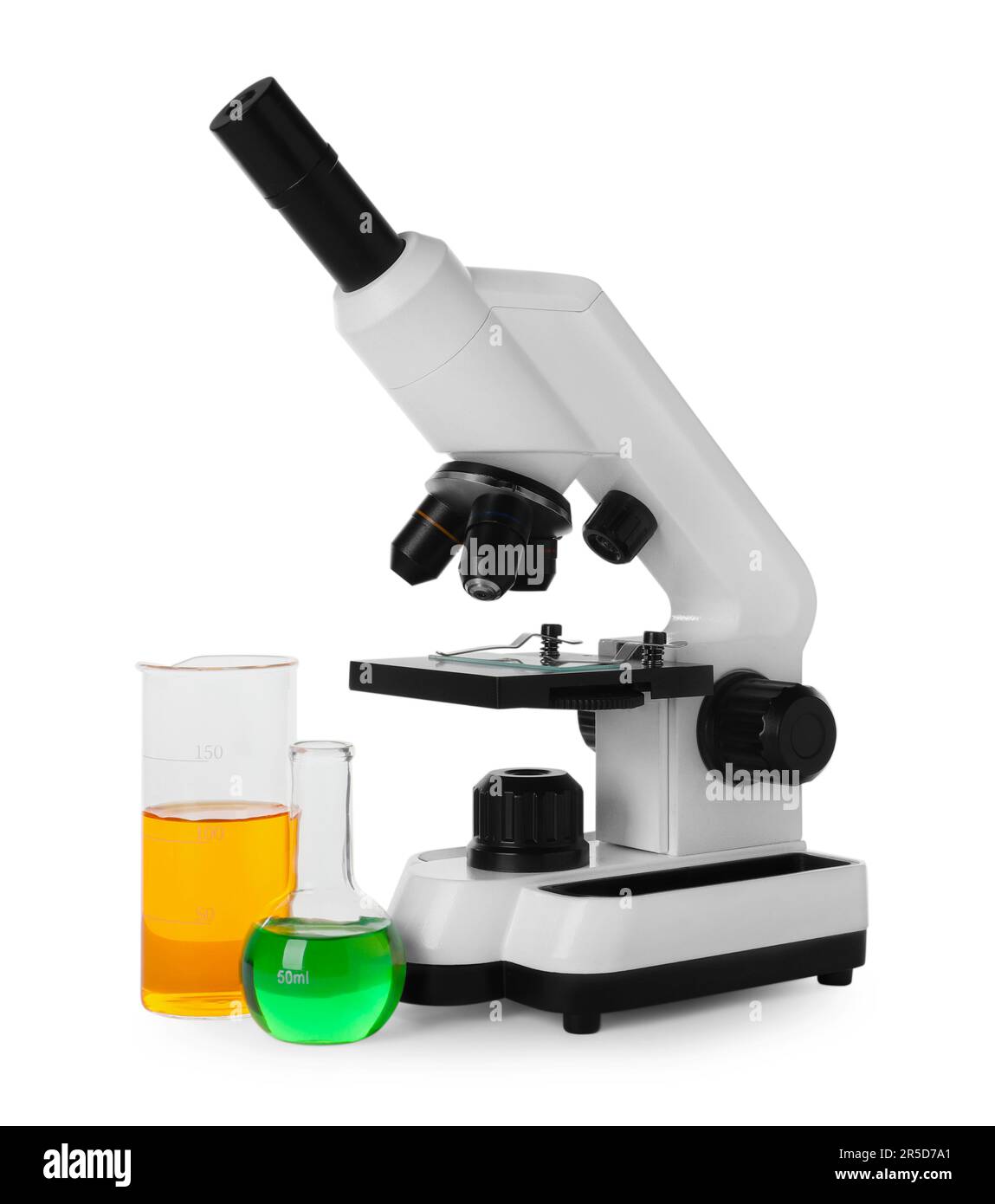 Laboratory glassware with colorful liquids and microscope isolated on ...