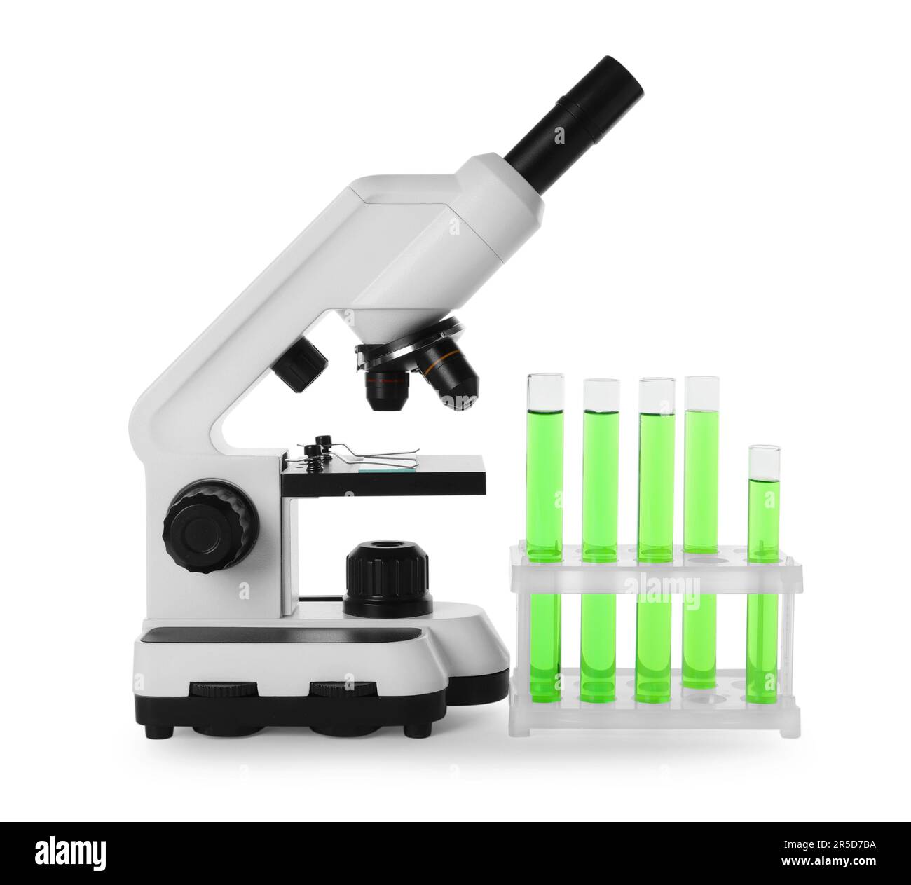 Test tubes with green liquid and microscope isolated on white Stock ...
