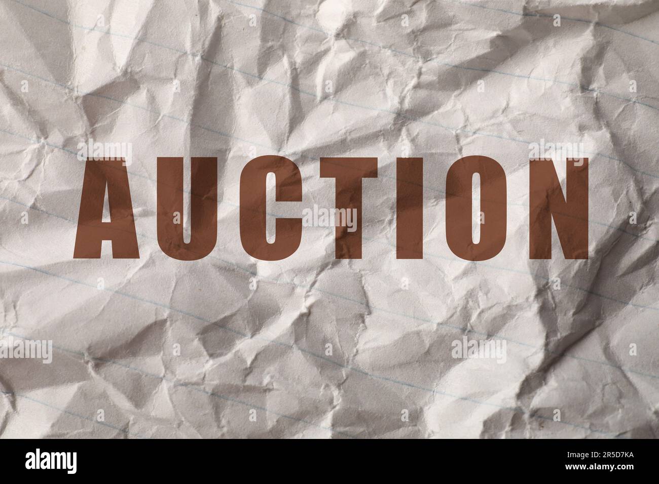 Word Auction on crumpled sheet of paper, closeup view Stock Photo - Alamy
