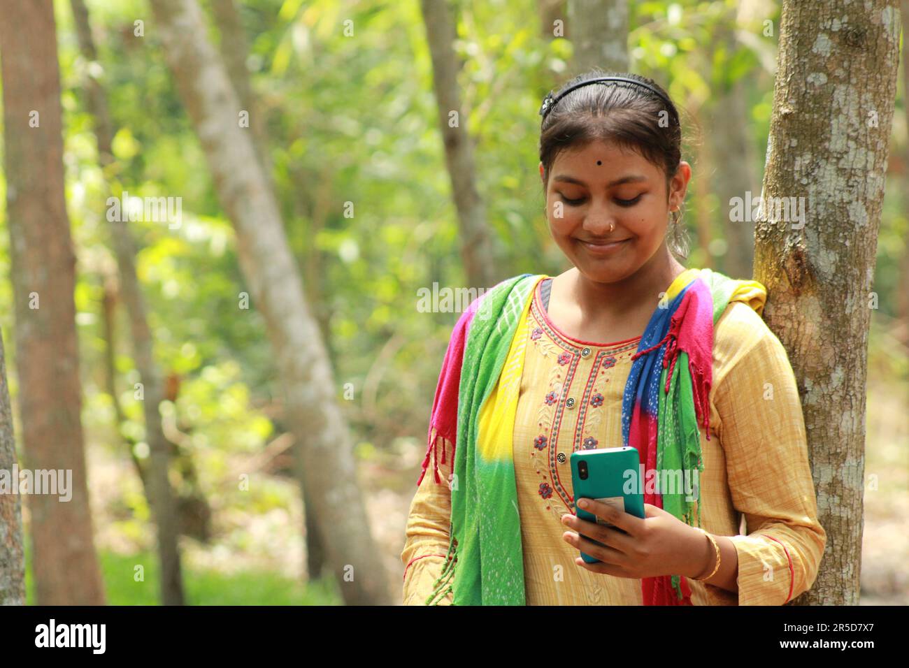 Indian Girl On A Mobile Phone Stock Photo - Alamy