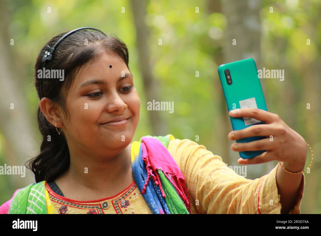 Indian Girl On A Mobile Phone Stock Photo - Alamy