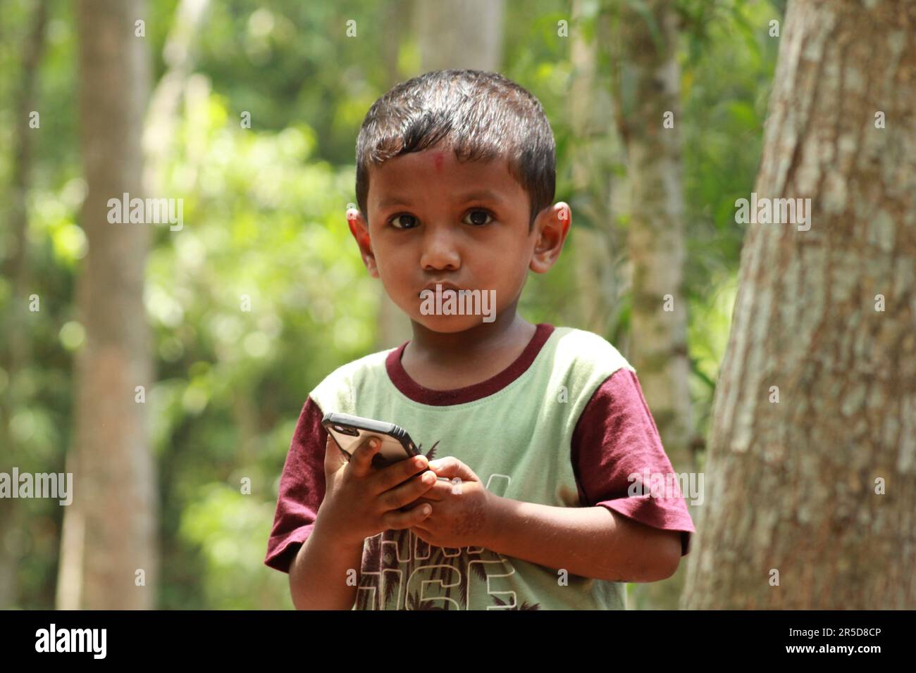 Indian little boy is standing Stock Photo - Alamy