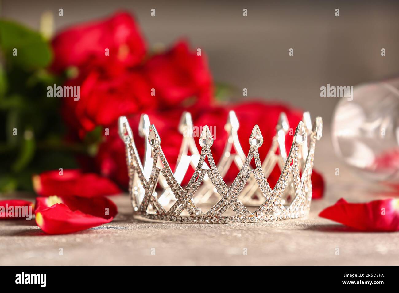 Beautiful crown with roses on grunge table, closeup. Prom concept Stock ...