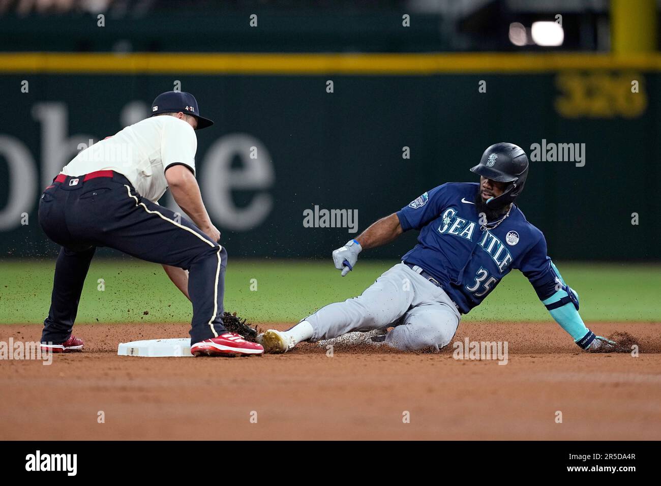 Texas Rangers shortstop Corey Seager, left, reaches down to tag out ...