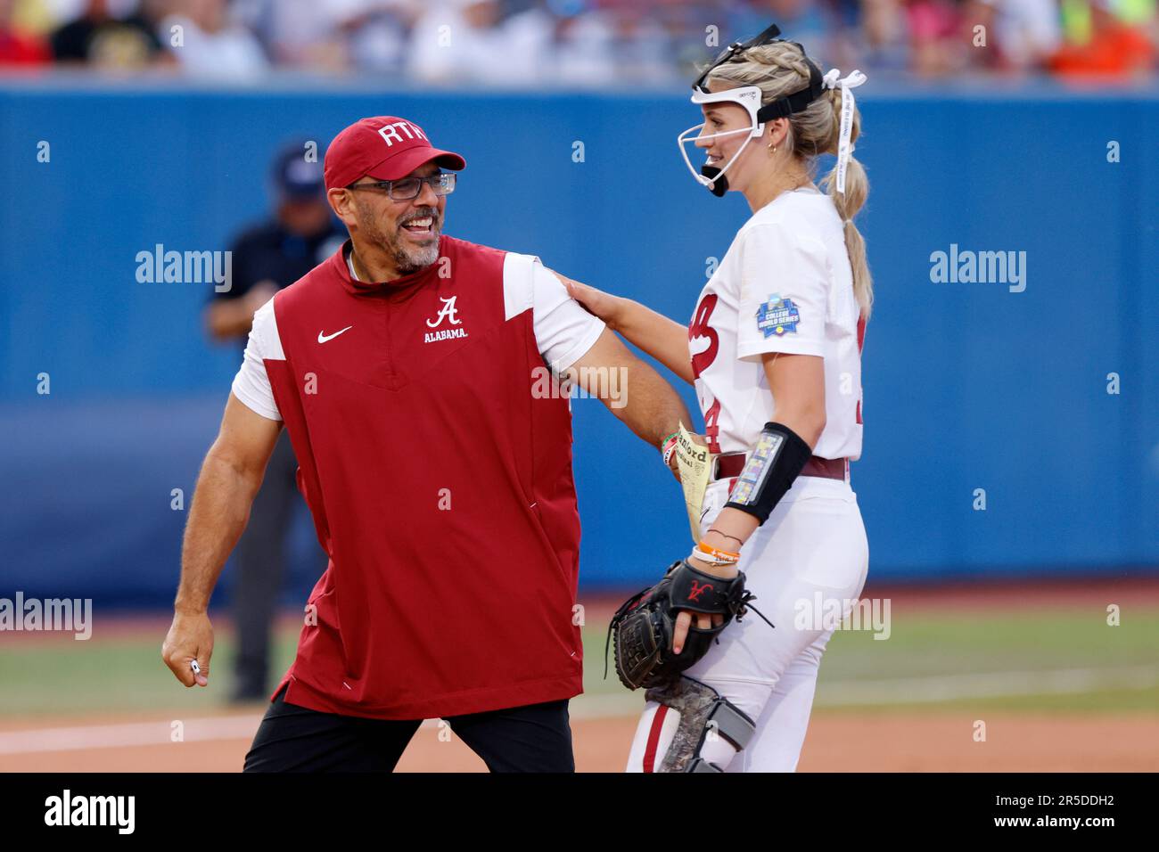 Alabama coach Patrick Murphy, left, talks to pitcher Montana Fouts ...