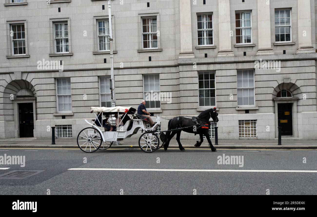 A traditional horse drawn carriage taking tourist on a tour in central ...