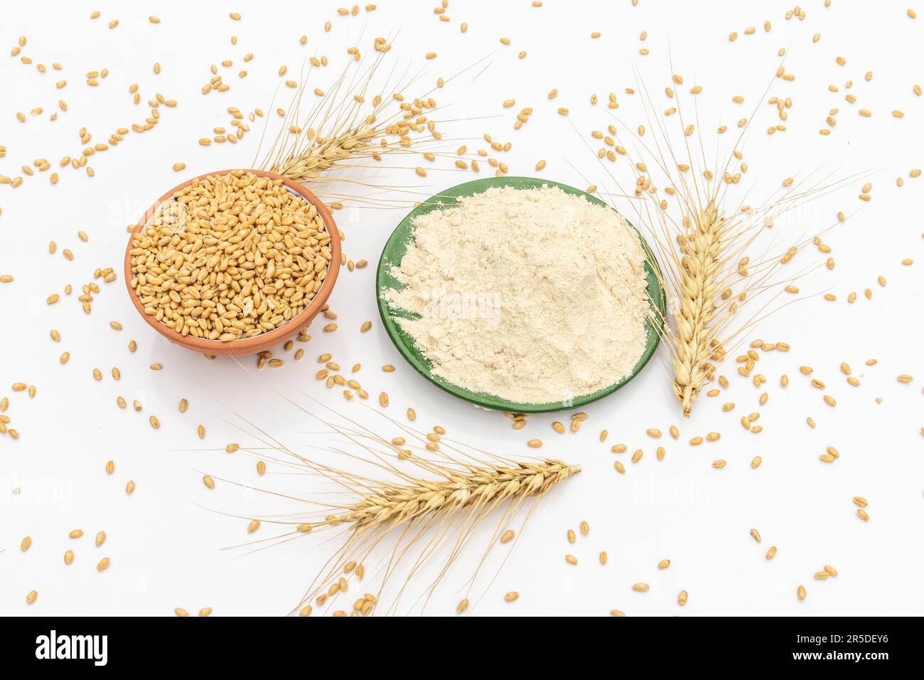 Wheat flour and wheat ears with grain isolated on white background ...