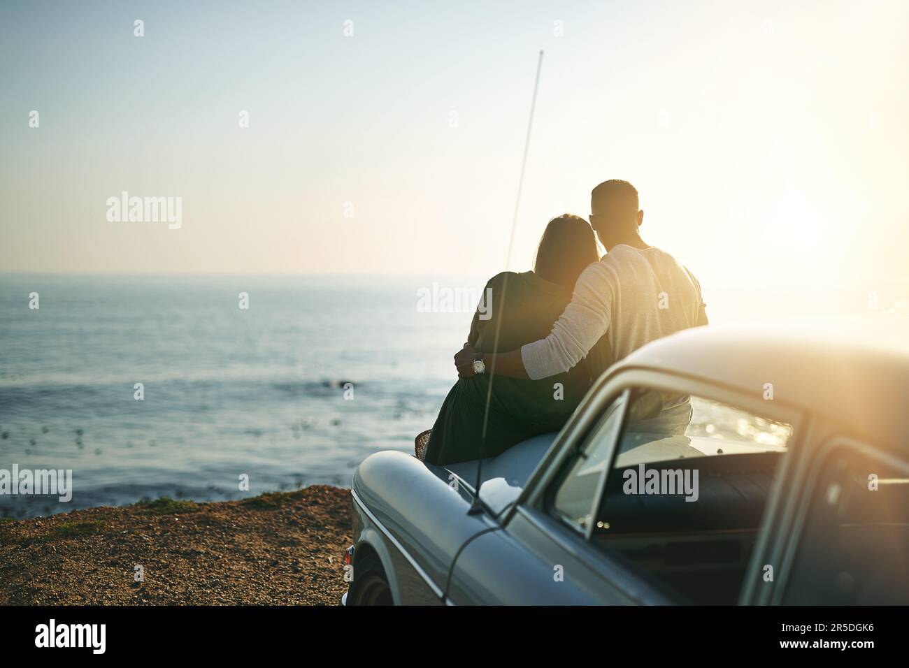 Ill go anywhere with you. a young couple making a stop at the beach ...