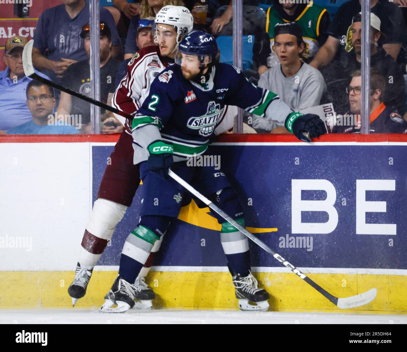 Seattle Thunderbirds defenseman Nolan Allan, right, checks Peterborough ...