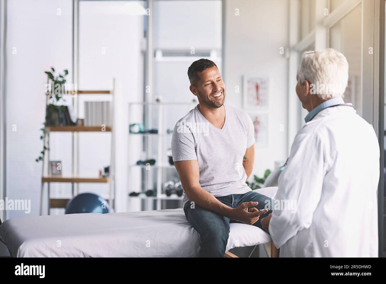 Well...that was easy. a senior doctor giving his male patient a ...