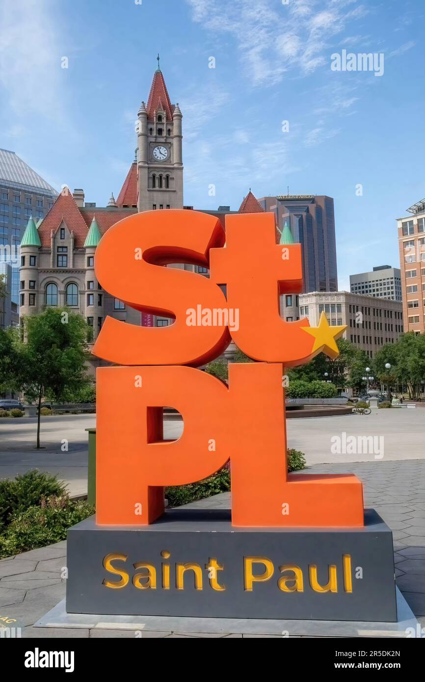 Colorful orange sign for St. Paul in Rice Park with the historic ...
