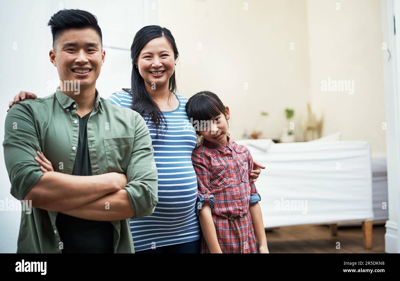 Our family keeps growing with love. Portrait of a happy family bonding ...