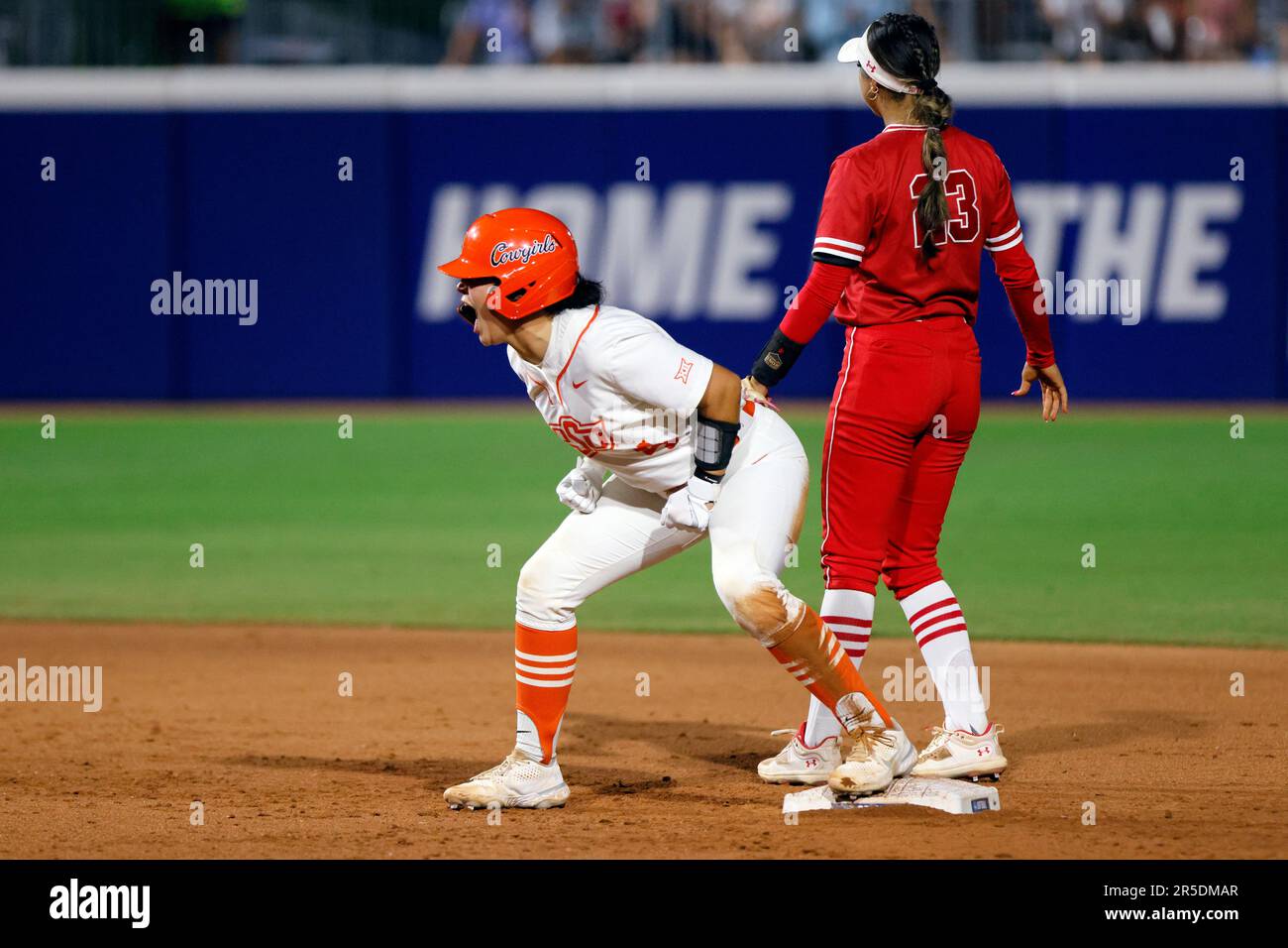Oklahoma State's Taylor Tuck, left, celebrates after a double next to ...